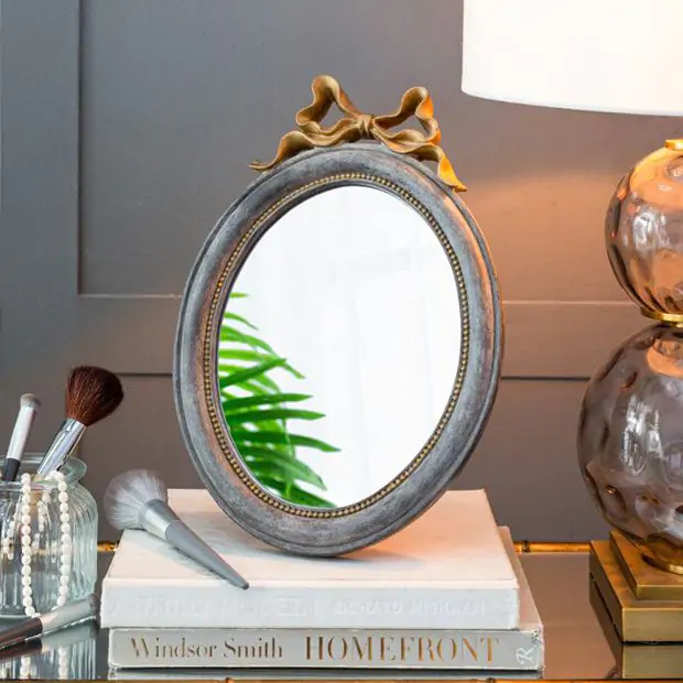 fancy bow oval mirror
