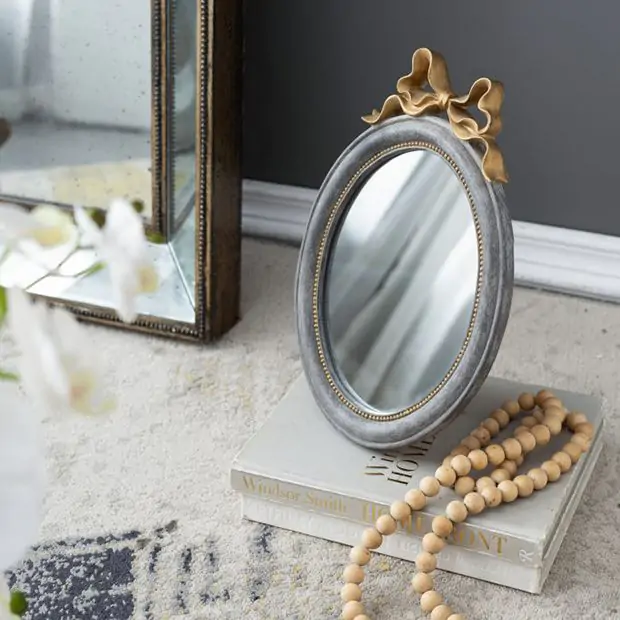 fancy bow oval mirror