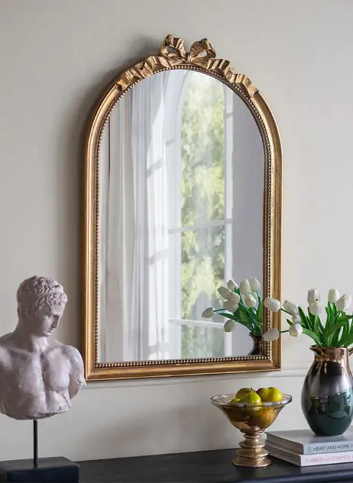 fancy bow oval mirror